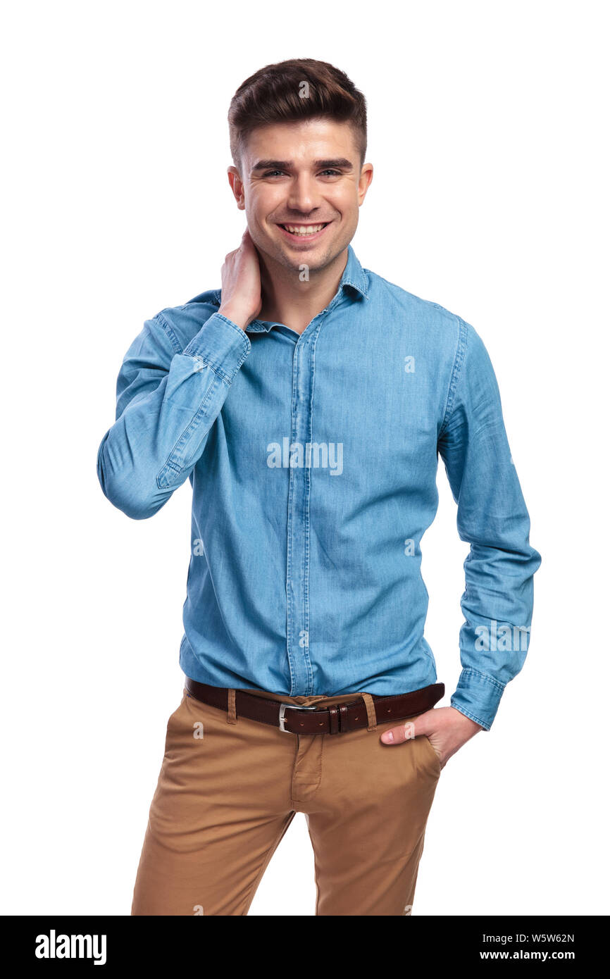 relaxed smiling casual man holding hand behind neck on white background ...