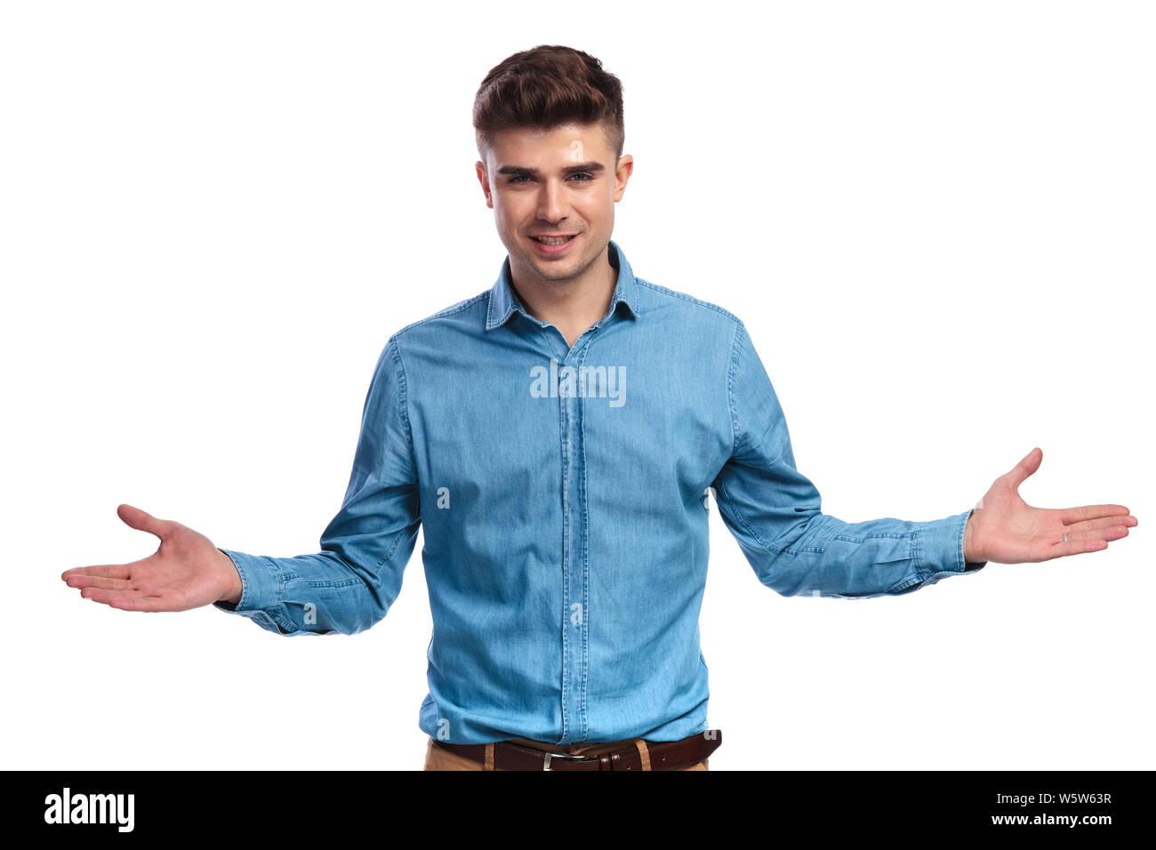 portrait of a welcoming young casual man on white background Stock ...