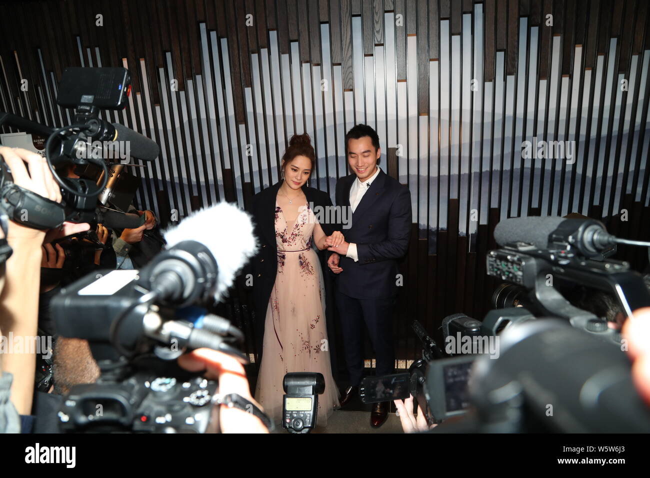 Hong Kong singer and actress Gillian Chung, left, of pop duo Twins, and ...