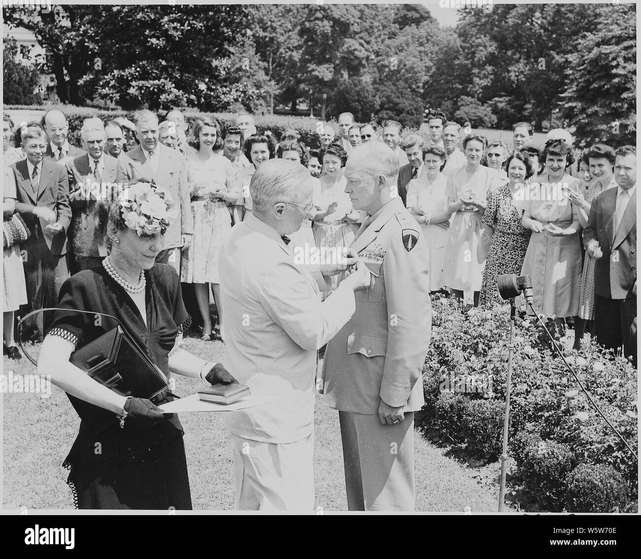 Photograph of President Truman pinning the Distinguished Service Medal ...
