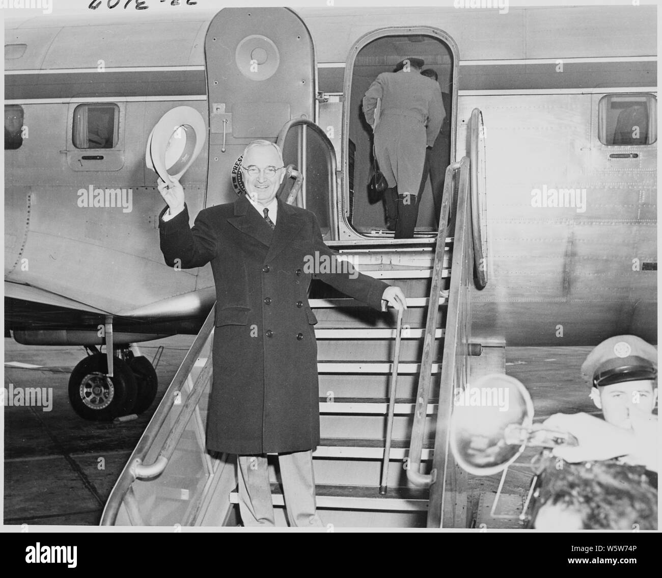 Photograph of President Truman preparing to board an airplane at ...