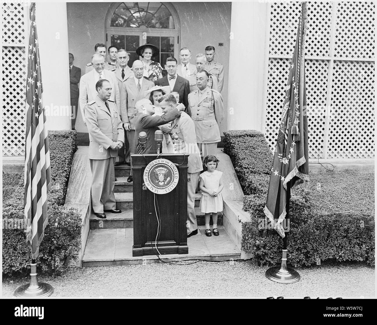 Photograph of President Truman presenting First Lt. Henry Commiskey of ...