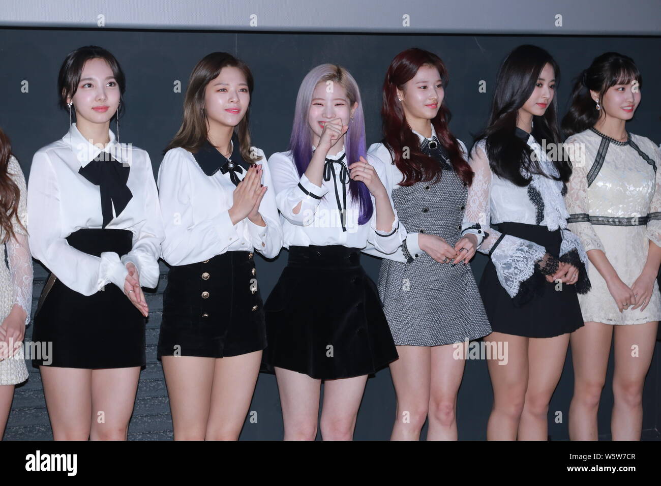 Members of South Korean girl group TWICE pose as they attend a press ...