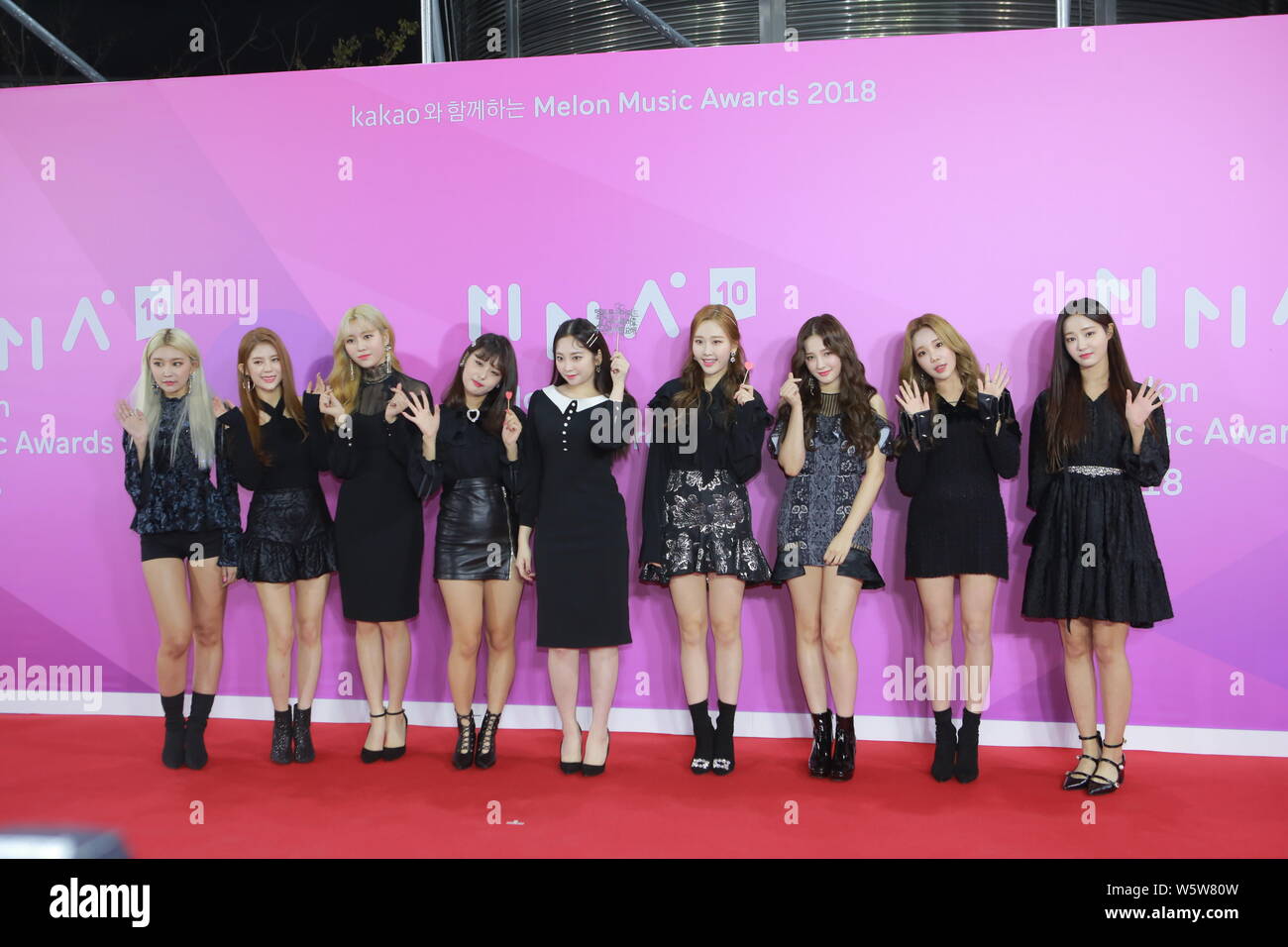 Members of South Korean girl group Momoland pose as they arrive on the ...