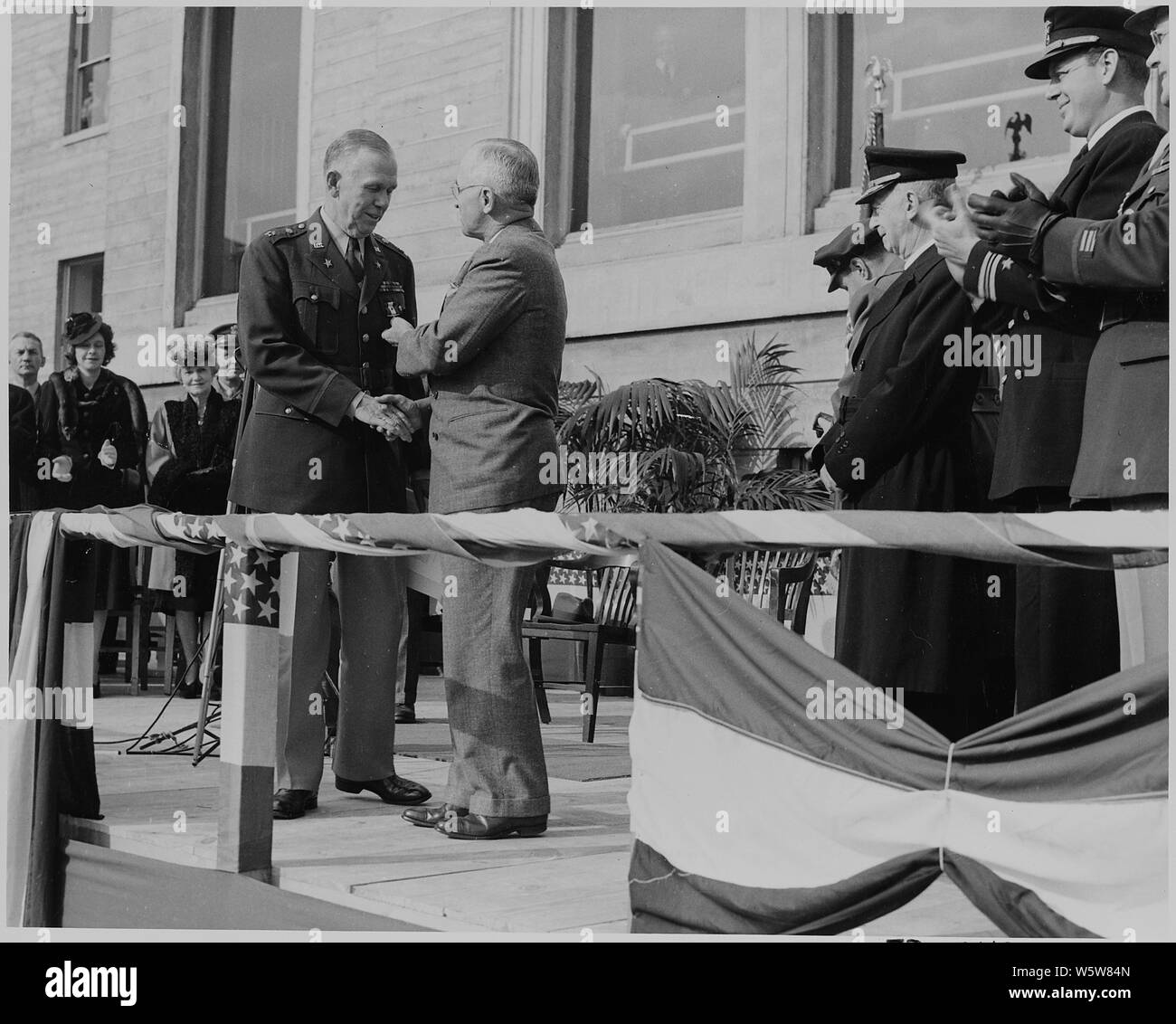 Photograph of President Truman shaking hands with General George C ...