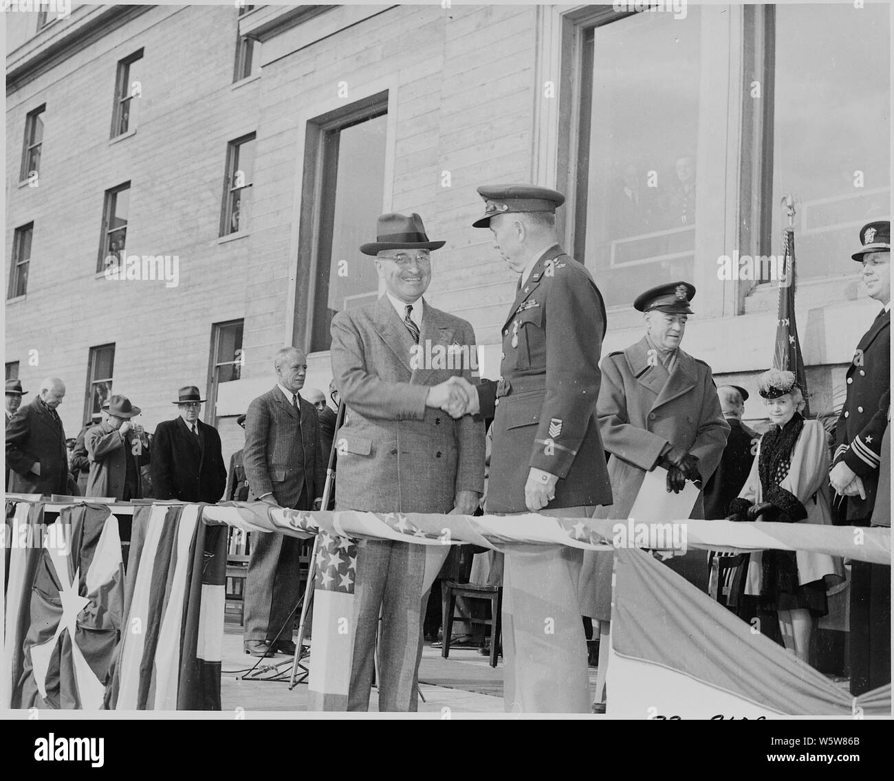 Photograph of President Truman shaking hands with General George C ...