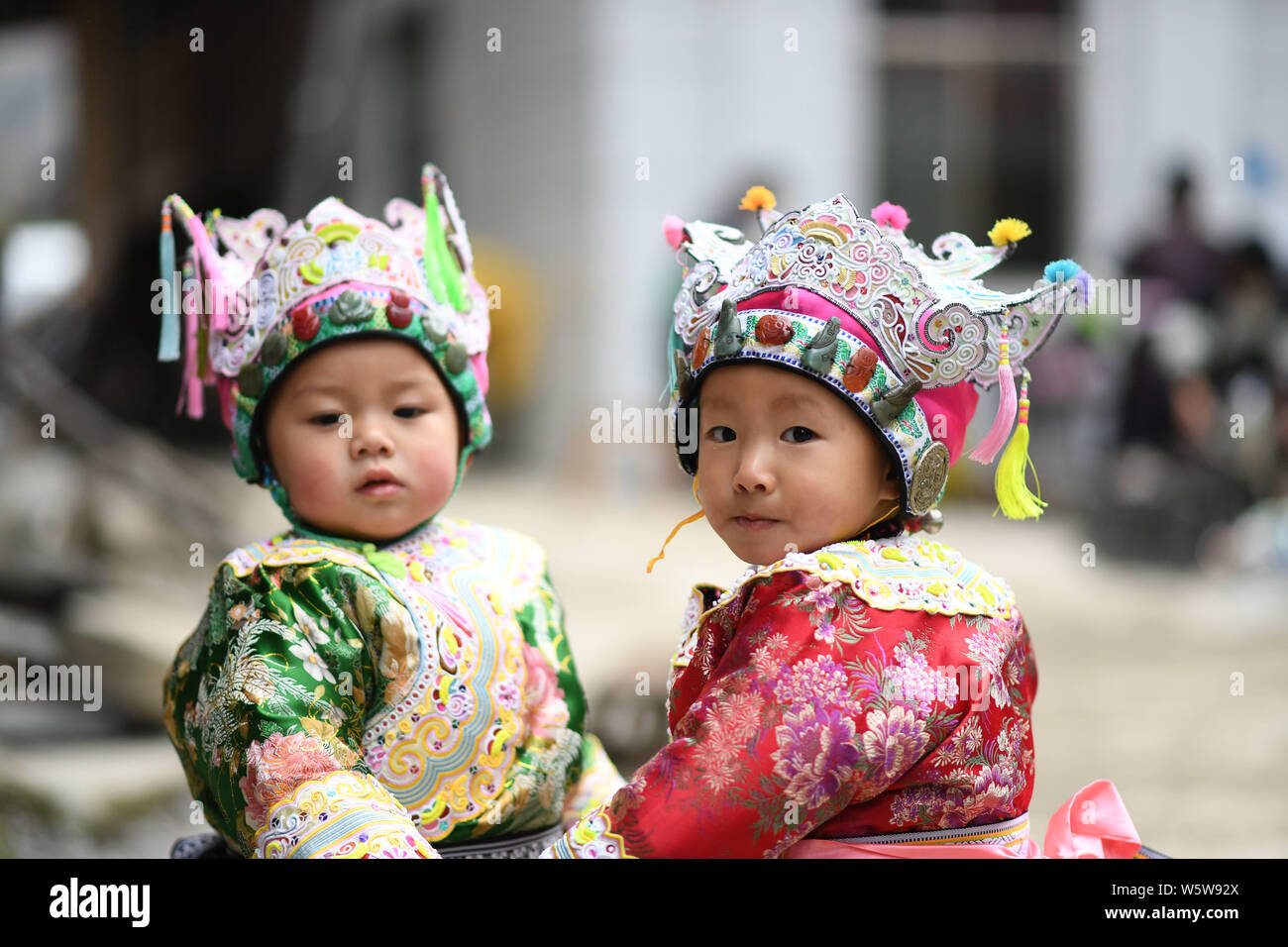 Children wearing hats with the characteristics of Dong ethnic group ...