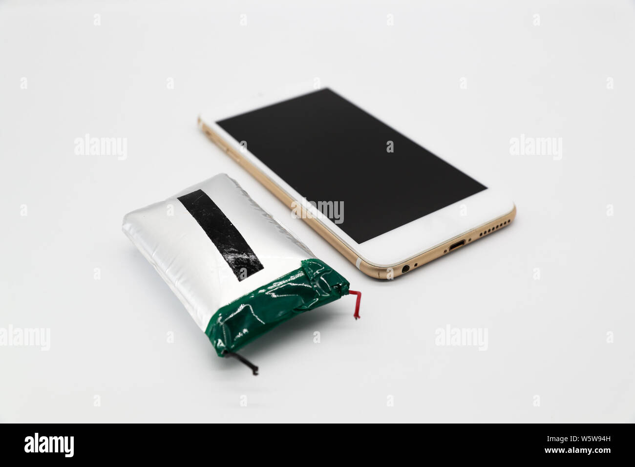 broken power bank with smart phone isolated and white background Stock ...