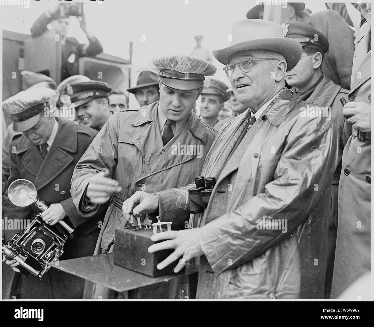 Photograph of President Truman throwing a switch during a demonstration ...