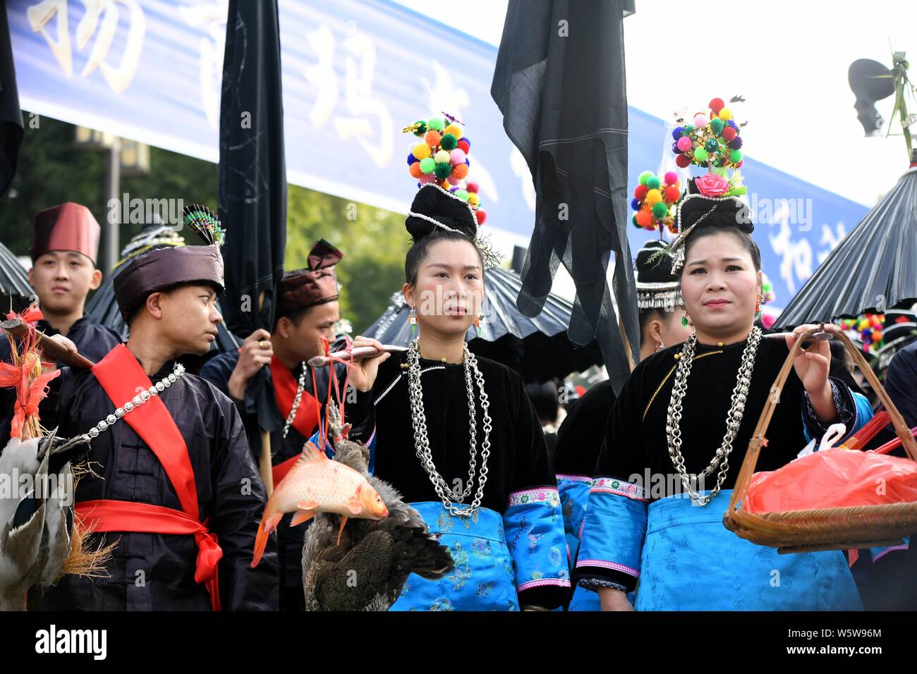 Chinese people of Dong ethnic group dressed in traditional silver ...