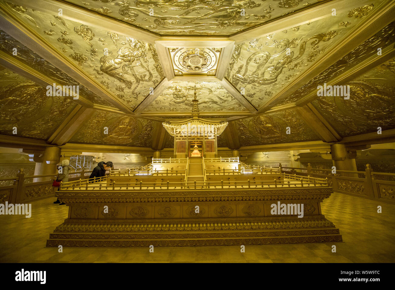 Interior view of the Buddhism Pure Copper Palace with a lying Buddha in ...
