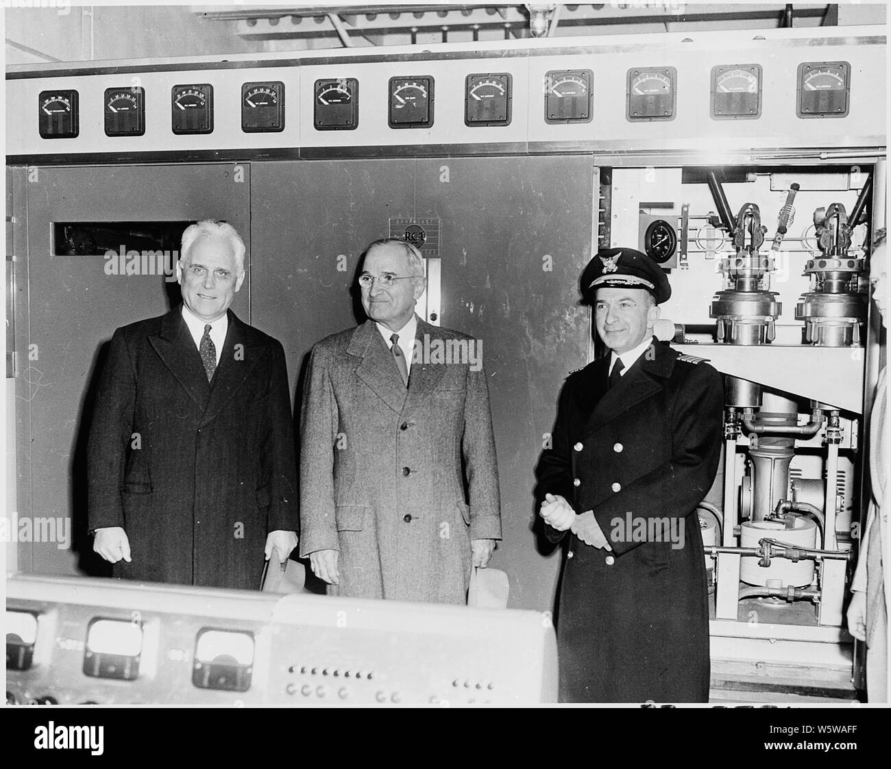 Photograph of President Truman with other dignitaries on board the U.S ...