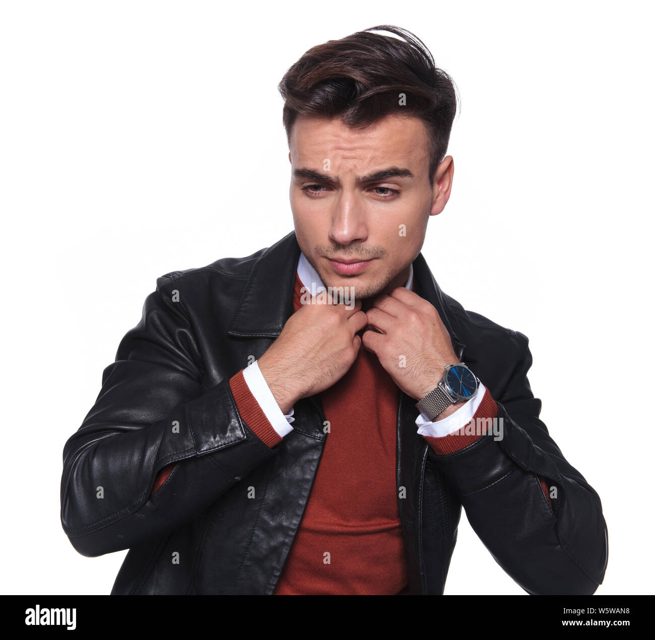 cool fashion man fixing his shirt's collar on white background Stock ...