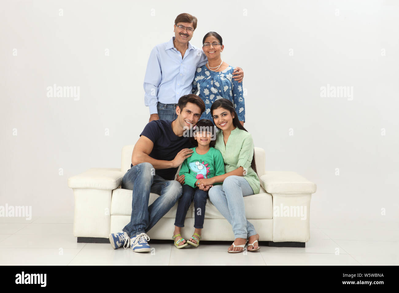 Family smiling at home Stock Photo - Alamy