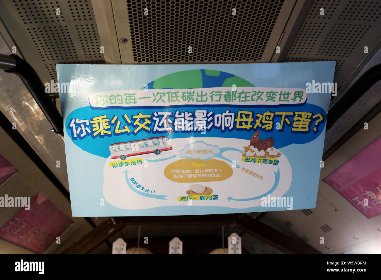 Passengers take a bus equipped with the large chicken coop, complete ...