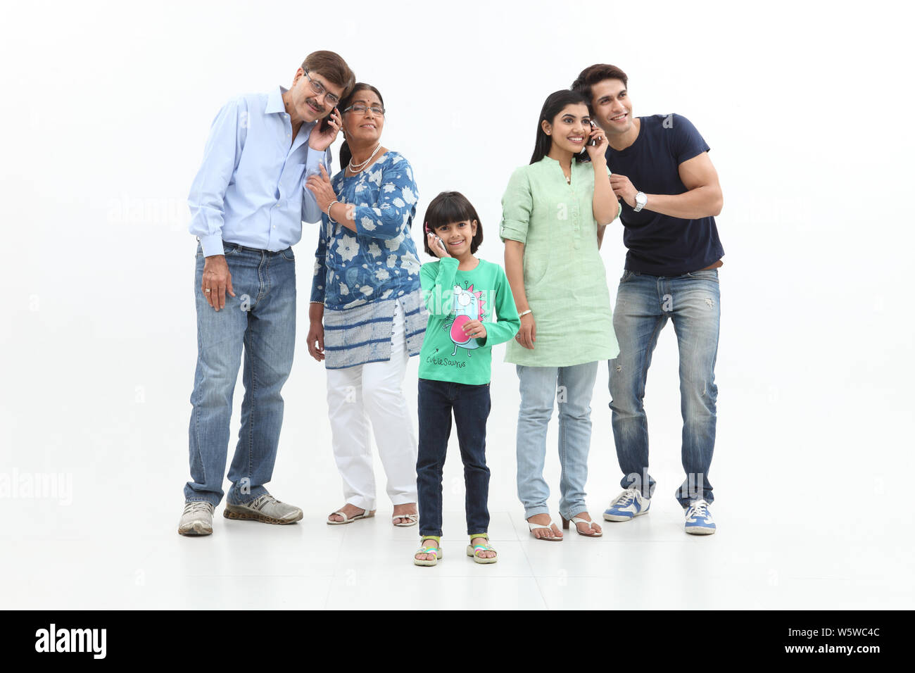 Family talking on mobile phone Stock Photo - Alamy