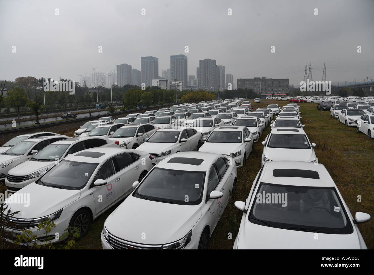 In this aerial view, abandoned ride-hailing vehicles are lined up after ...