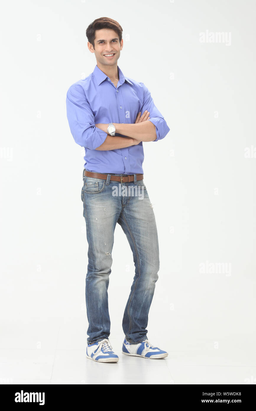 Man standing with his arms crossed Stock Photo - Alamy