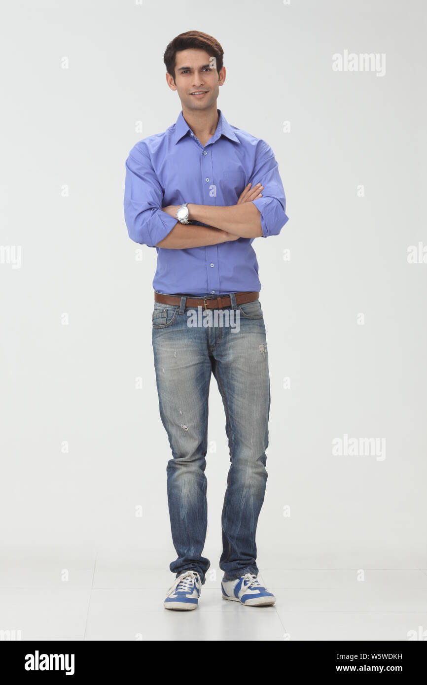 Man standing with his arms crossed Stock Photo - Alamy