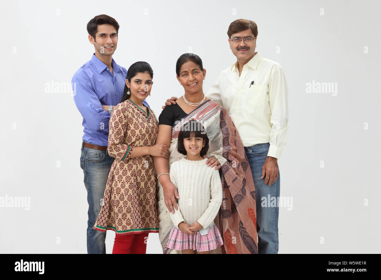 Family standing together Stock Photo - Alamy