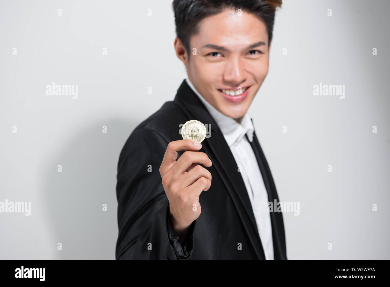 Bitcoin btc coin man holding hi-res stock photography and images - Alamy