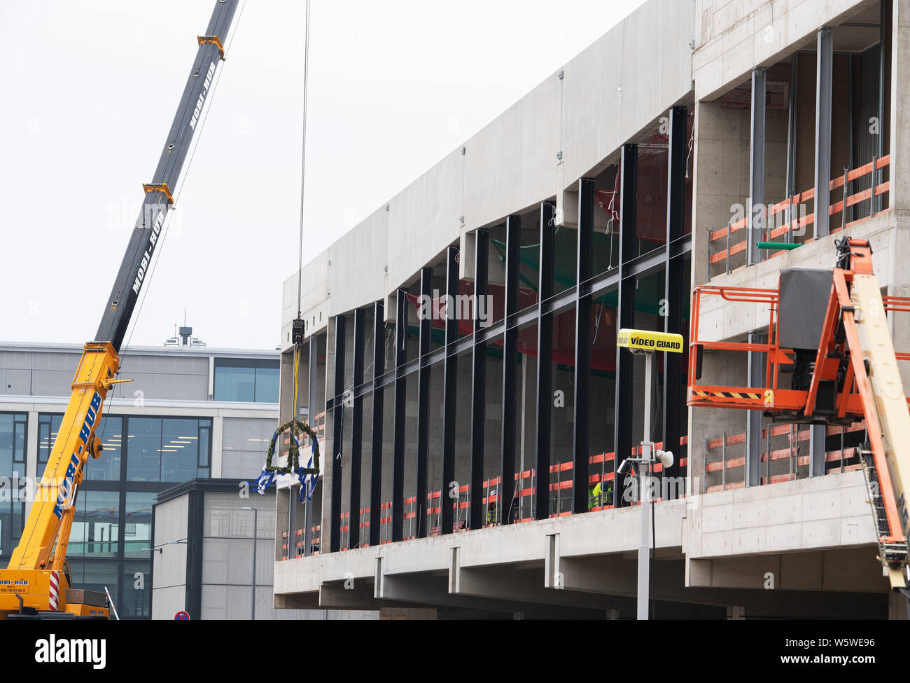 Berlin, Germany. 30th July, 2019. During the topping-out ceremony for ...