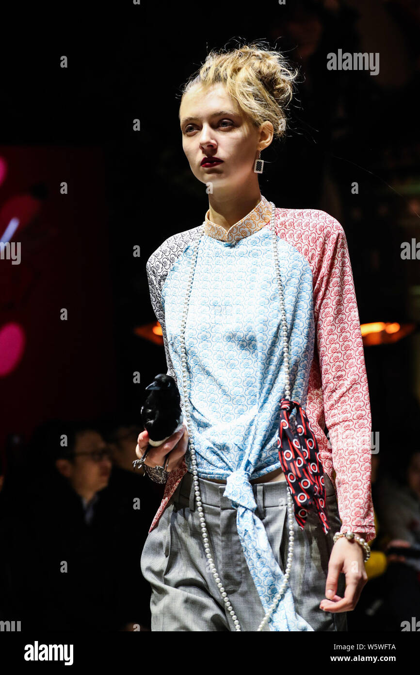 A model displays a new creation during the OPPO Fantasy New Year Big ...