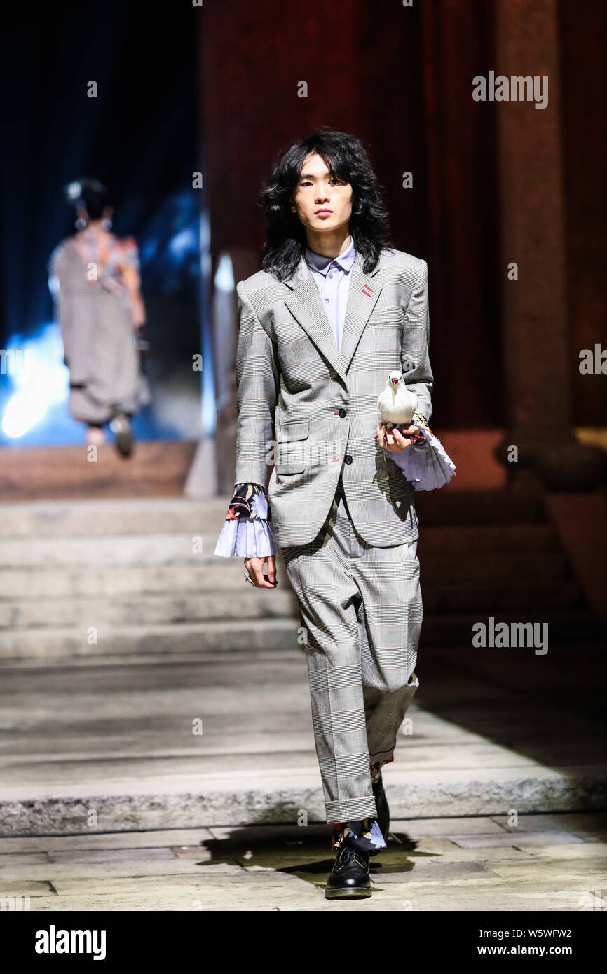 A model displays a new creation during the OPPO Fantasy New Year Big ...