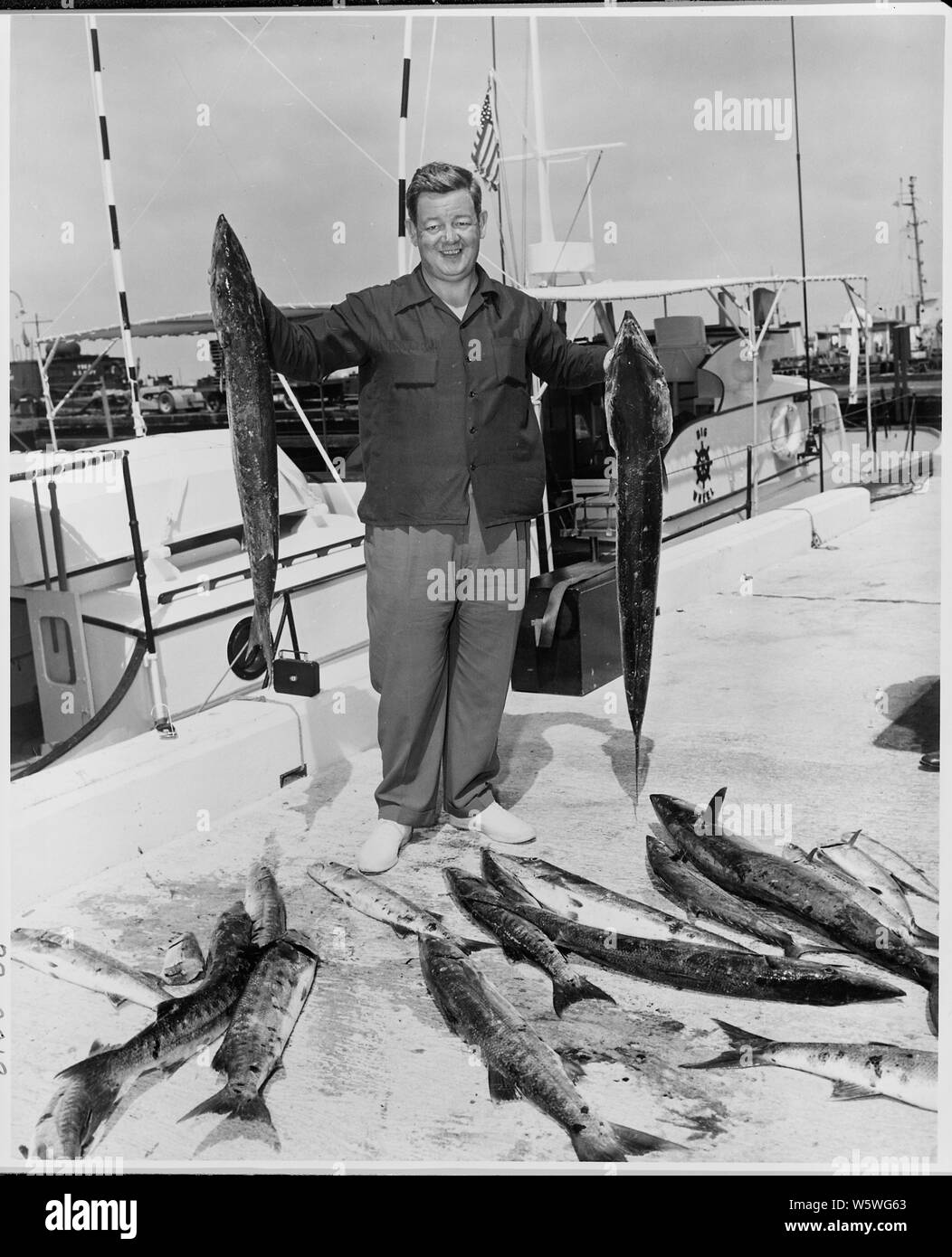Photograph of White House aide Joseph Feeney with fish he caught during ...