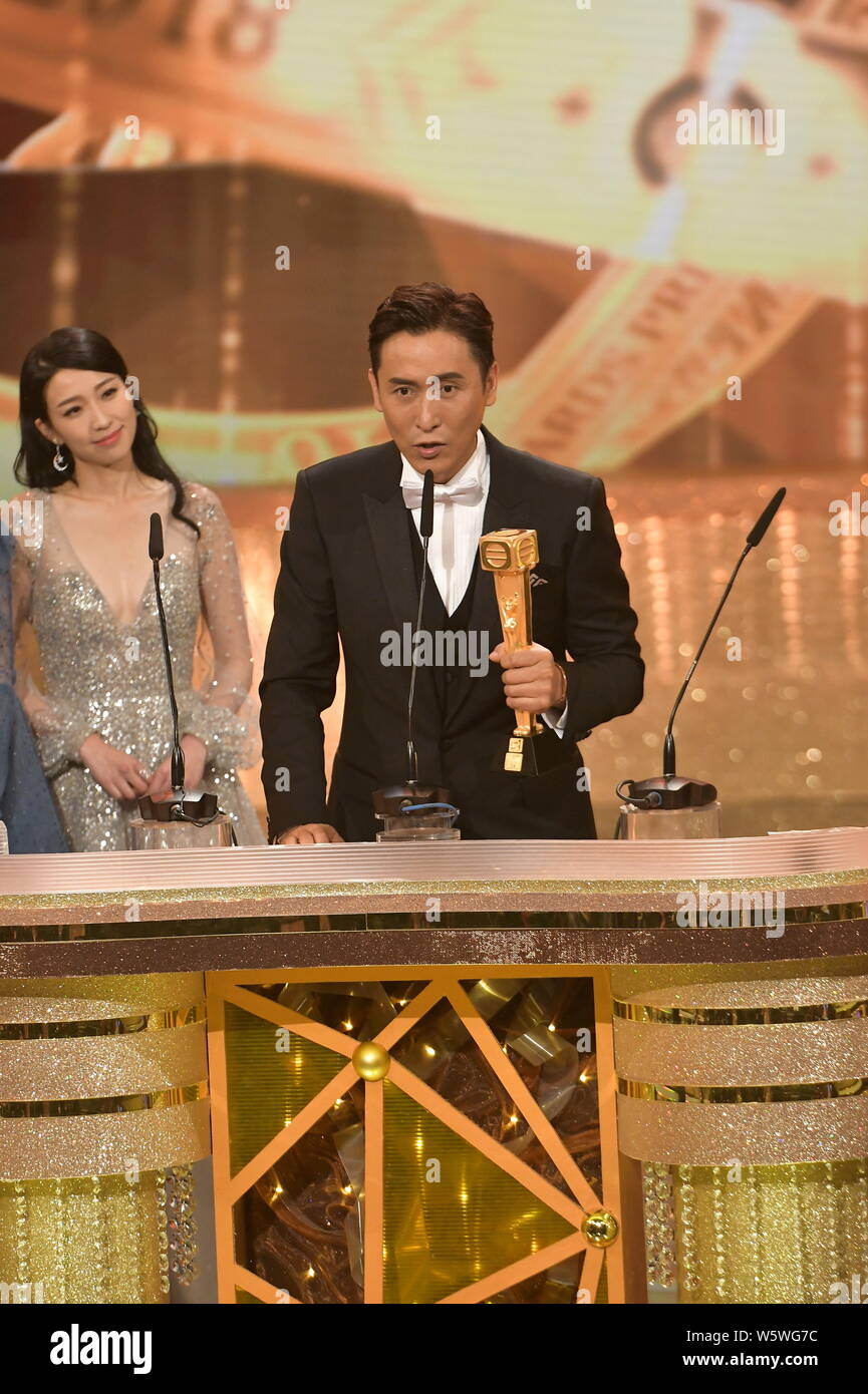 Joe Ma poses with his trophy of the Best Actor award at the 2018 TVB ...