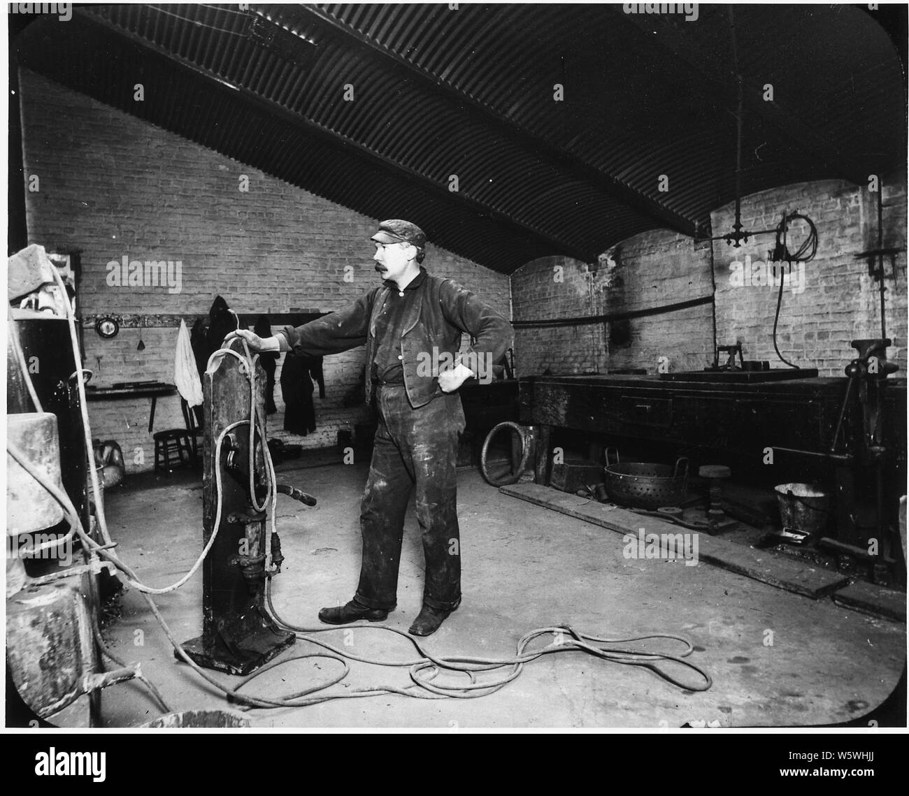 Photograph of a San Francisco Mint employee in an attic workshop Stock ...