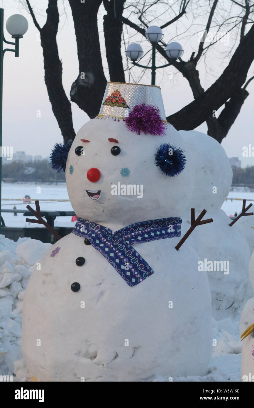 A decorated snowman is pictured alongside the Songhua River in Harbin ...