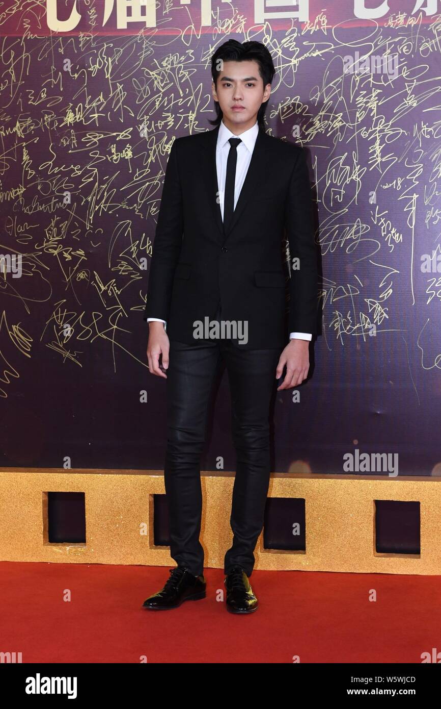 Chinese singer and actor Kris Wu or Wu Yifan poses as he arrives on the ...