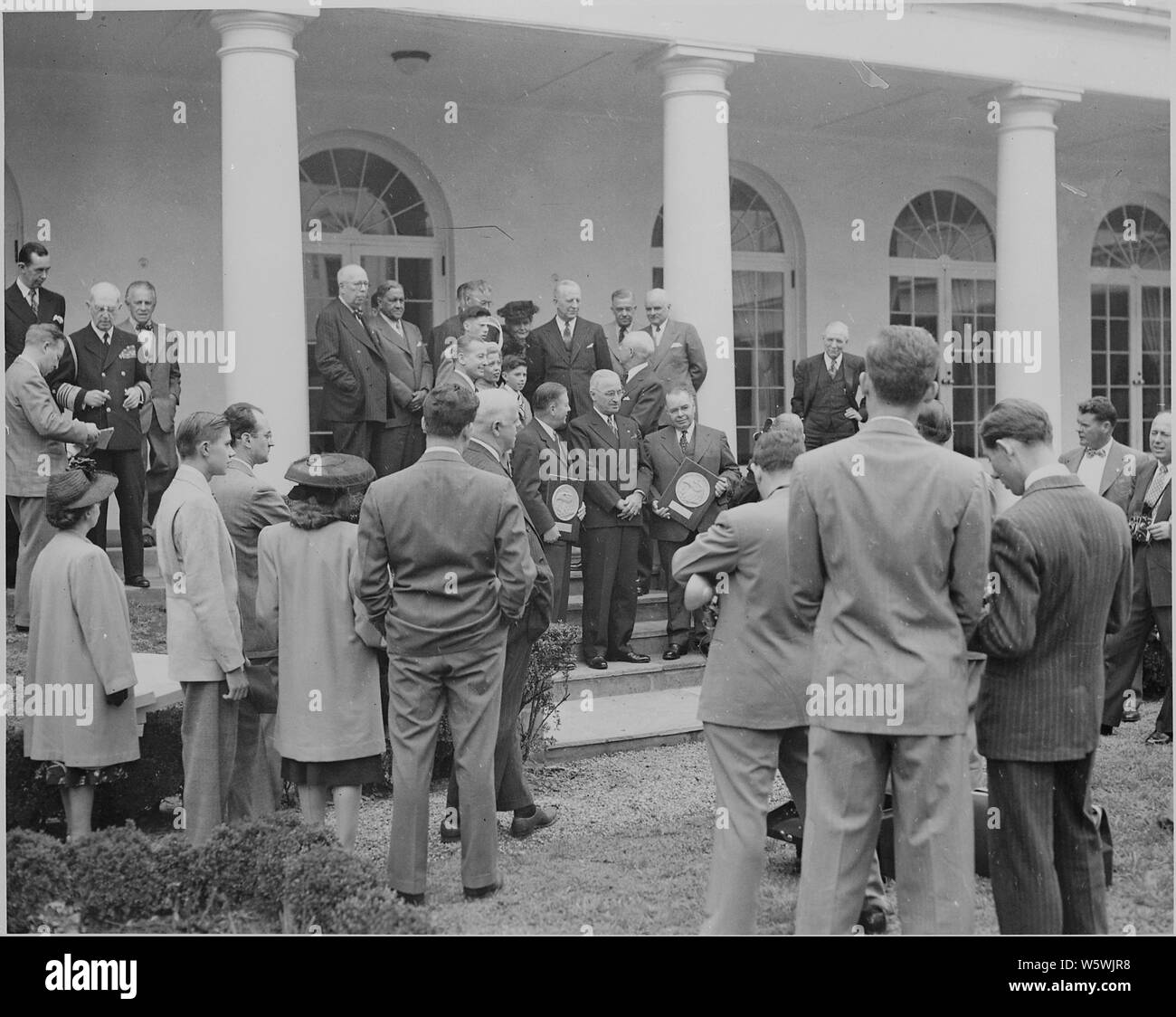 Photograph of ceremony at the White House at which President Truman ...