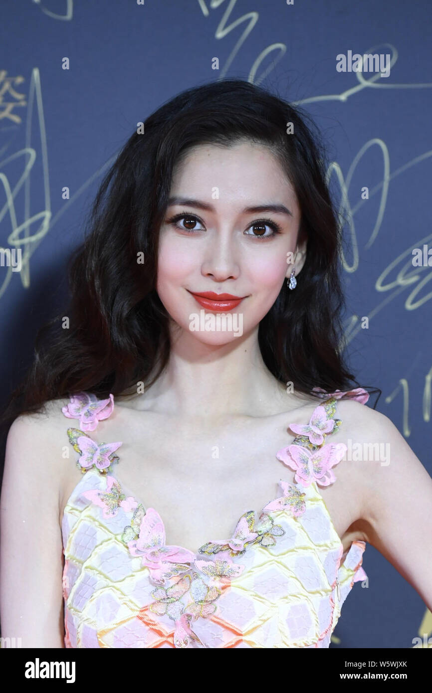 Hong Kong actress Angelababy poses as she arrives on the red carpet for the 2018 Marie Claire ...