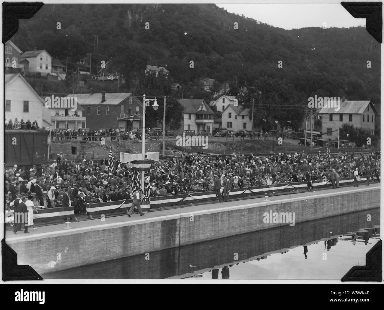 Photograph of crowd onshore assembled for Alma, WI dam dedication Stock ...