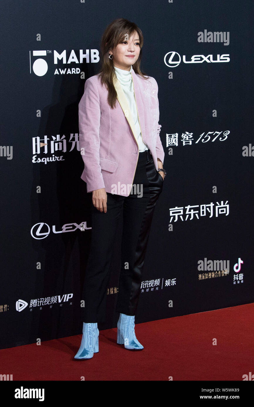 Chinese actress Zhao Wei poses as she arrives for the 15th Esquire Men ...