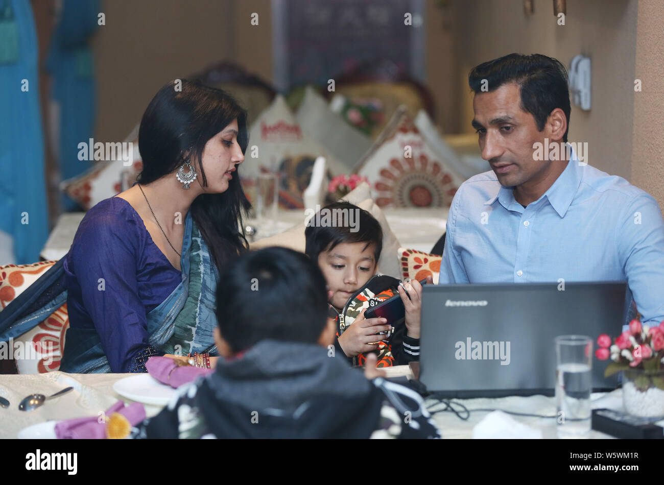 Indian man Dev Raturi, who owns eight restaurants, is pictured with his ...