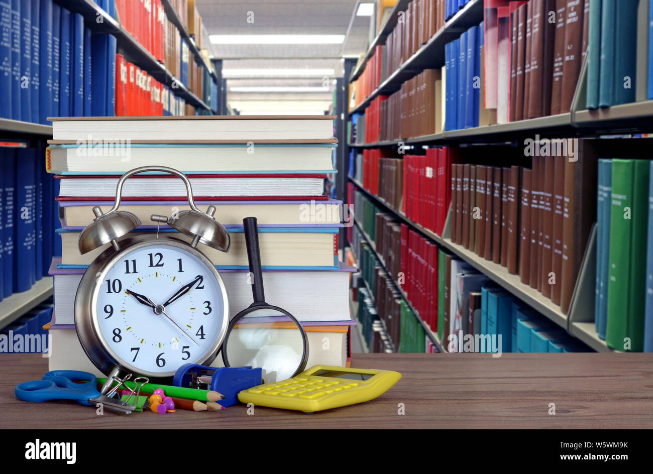 open book on the wooden table in library Stock Photo - Alamy
