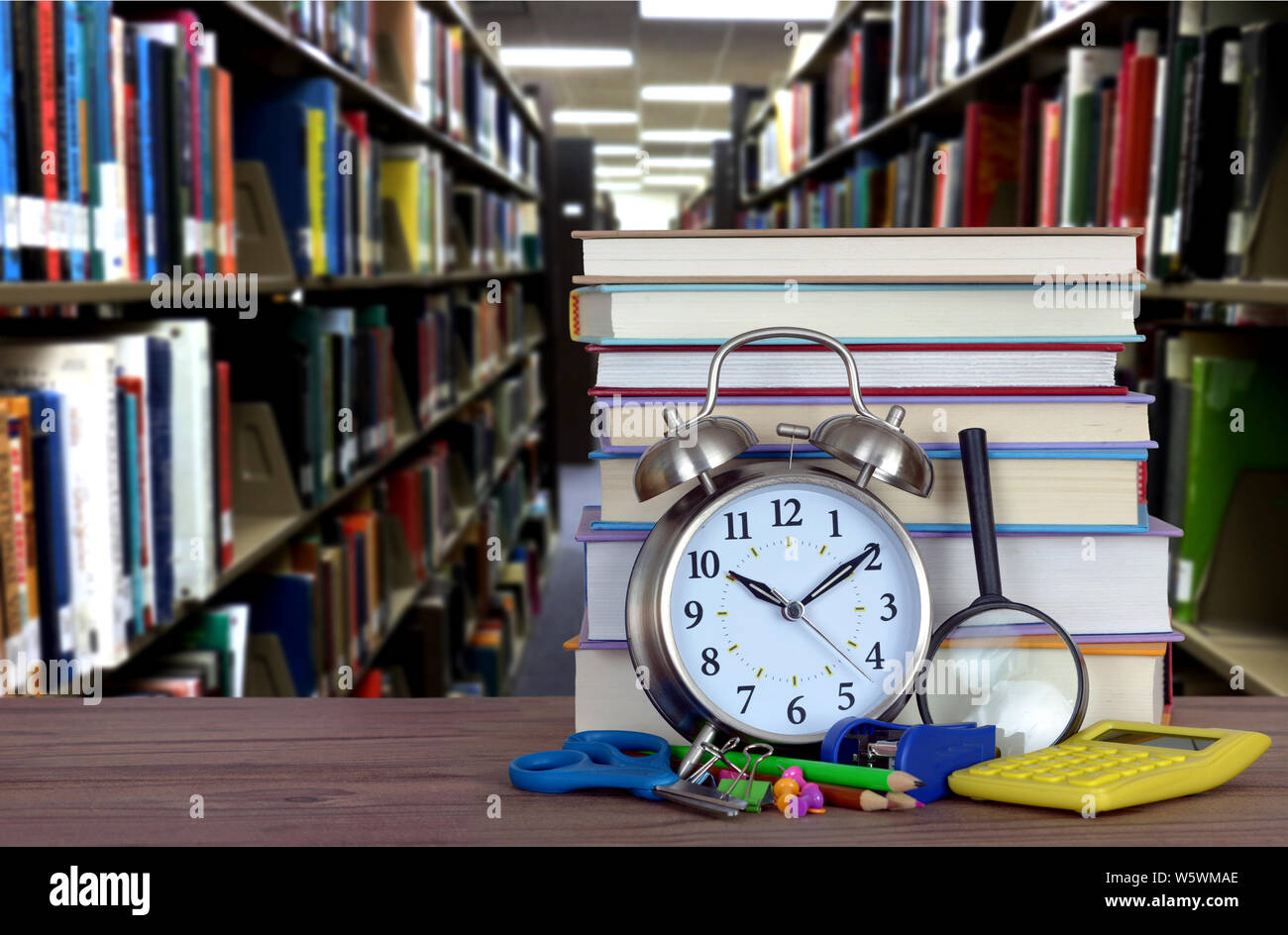 open book on the wooden table in library Stock Photo - Alamy