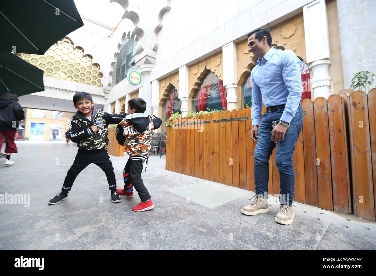 Indian man Dev Raturi, who owns eight restaurants, teaches his sons to ...