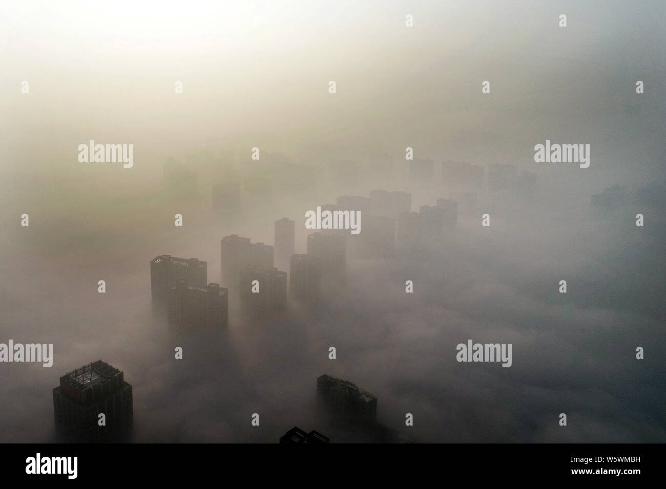 An aerial view of skyscrapers shrouded by heavy fog in Changzhou city ...