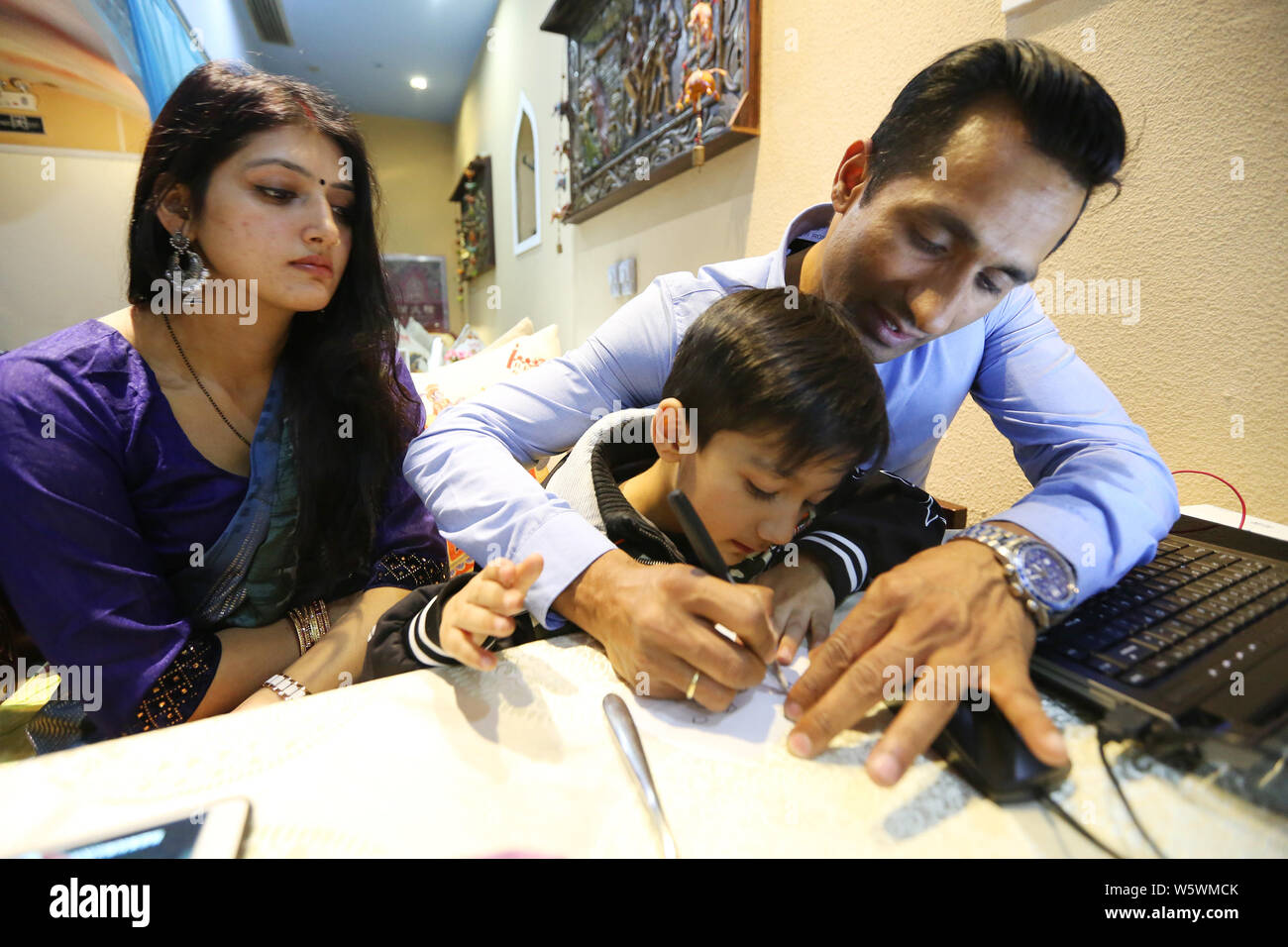 Indian man Dev Raturi, who owns eight restaurants, is pictured with his ...