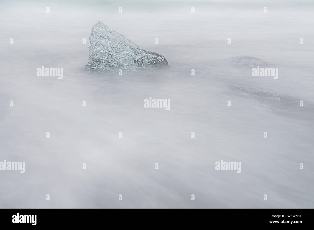 Melted glacier ice blocks floating as diamond crystals in Jokulsarlon ...