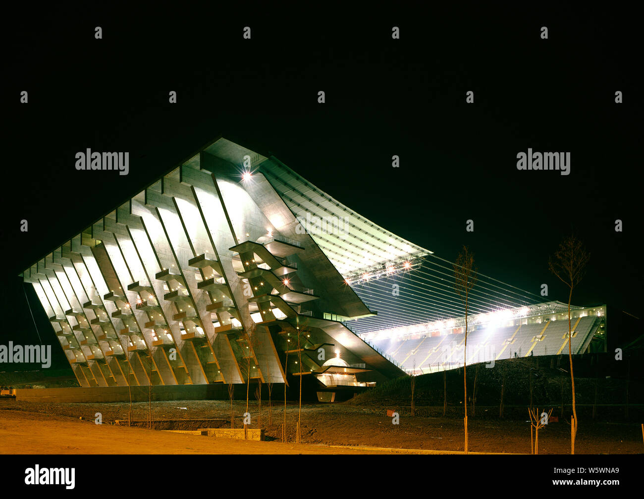 Building at night with sloping roof and cable structures. Municipal ...