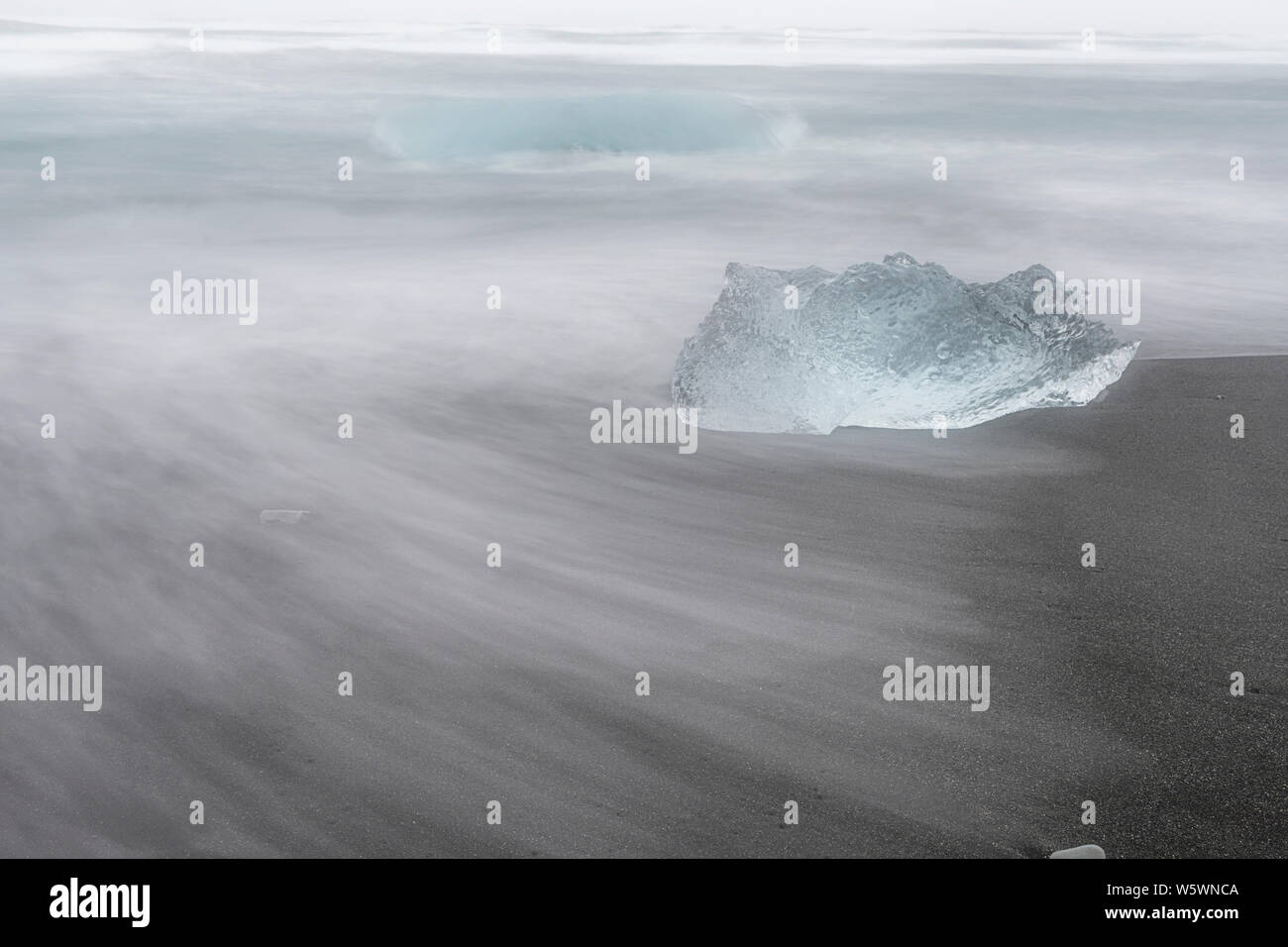 Melted glacier ice blocks floating as diamond crystals in Jokulsarlon ...