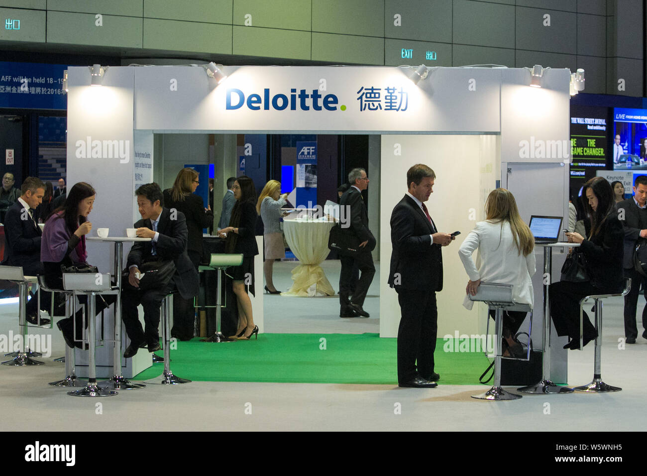 --FILE--People visit the stand of Deloitte during an exhibition in Hong Kong, China, 19 January ...