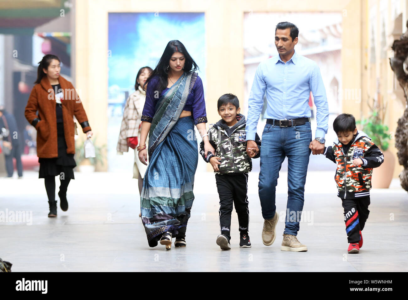 Indian man Dev Raturi, who owns eight restaurants, is pictured with his ...