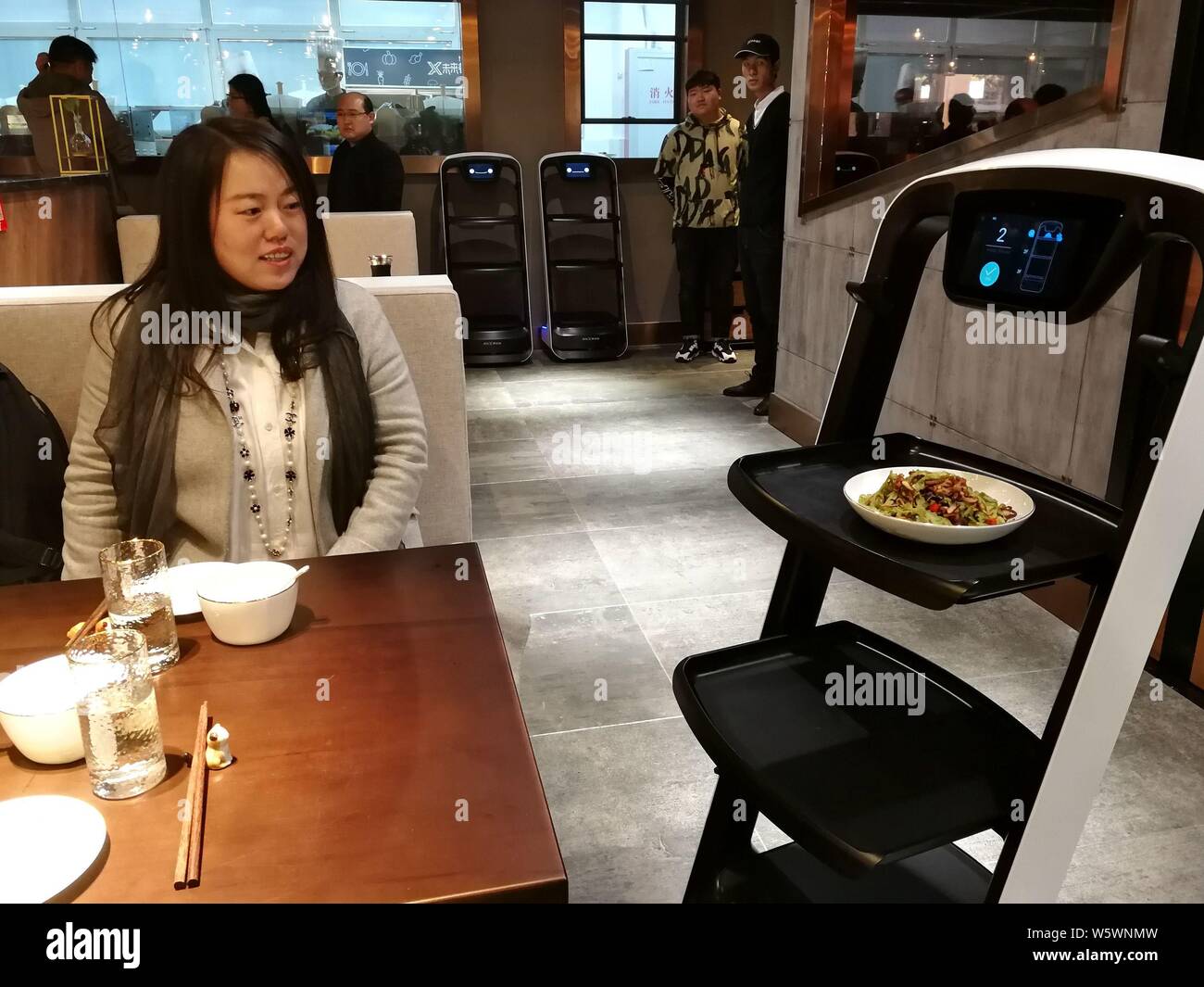 A robot serves customers at the Chinese online retailer JD.com's robot ...