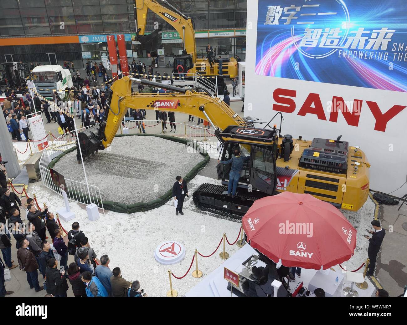 People visit the stand of SANY at the 9th International Trade Fair for ...